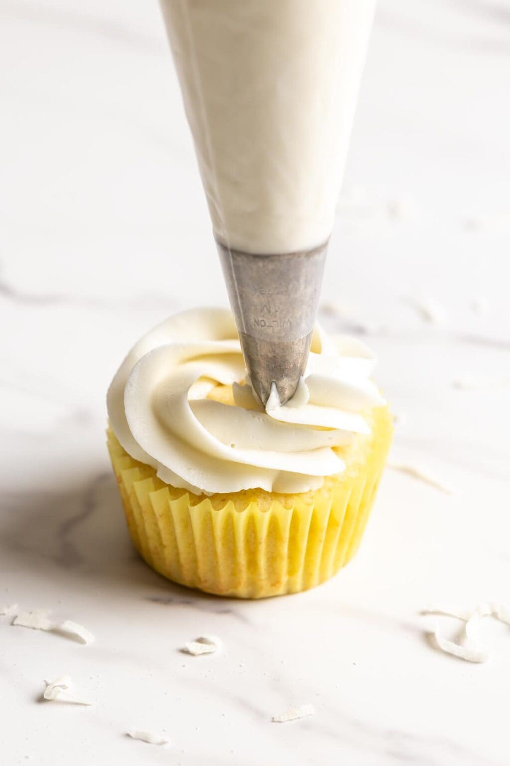 Incredibly Easy Coconut Buttercream Frosting - Wild Wild Whisk